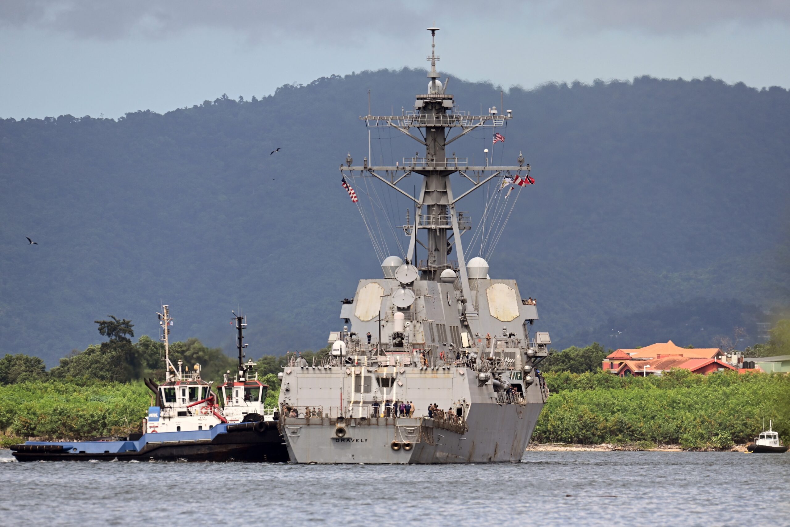 U.S. continues threats, circling Venezuela with warship in Trinidad and ...